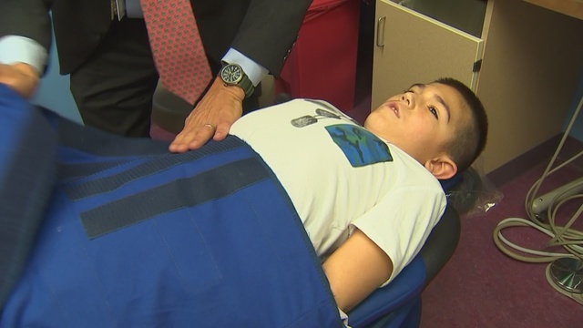 Dentist says controversial restraint technique can help soothe younger ...